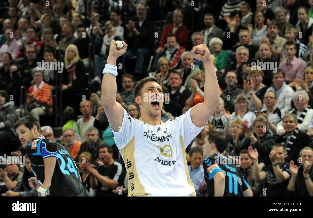 Kiel's handball player Marcus Ahlm cheers after winning the return ...