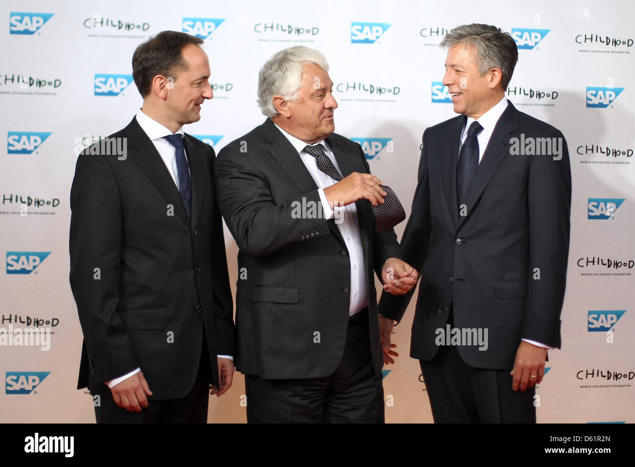 SAP founding member Hasso Plattner (C) is flanked by the members of the ...