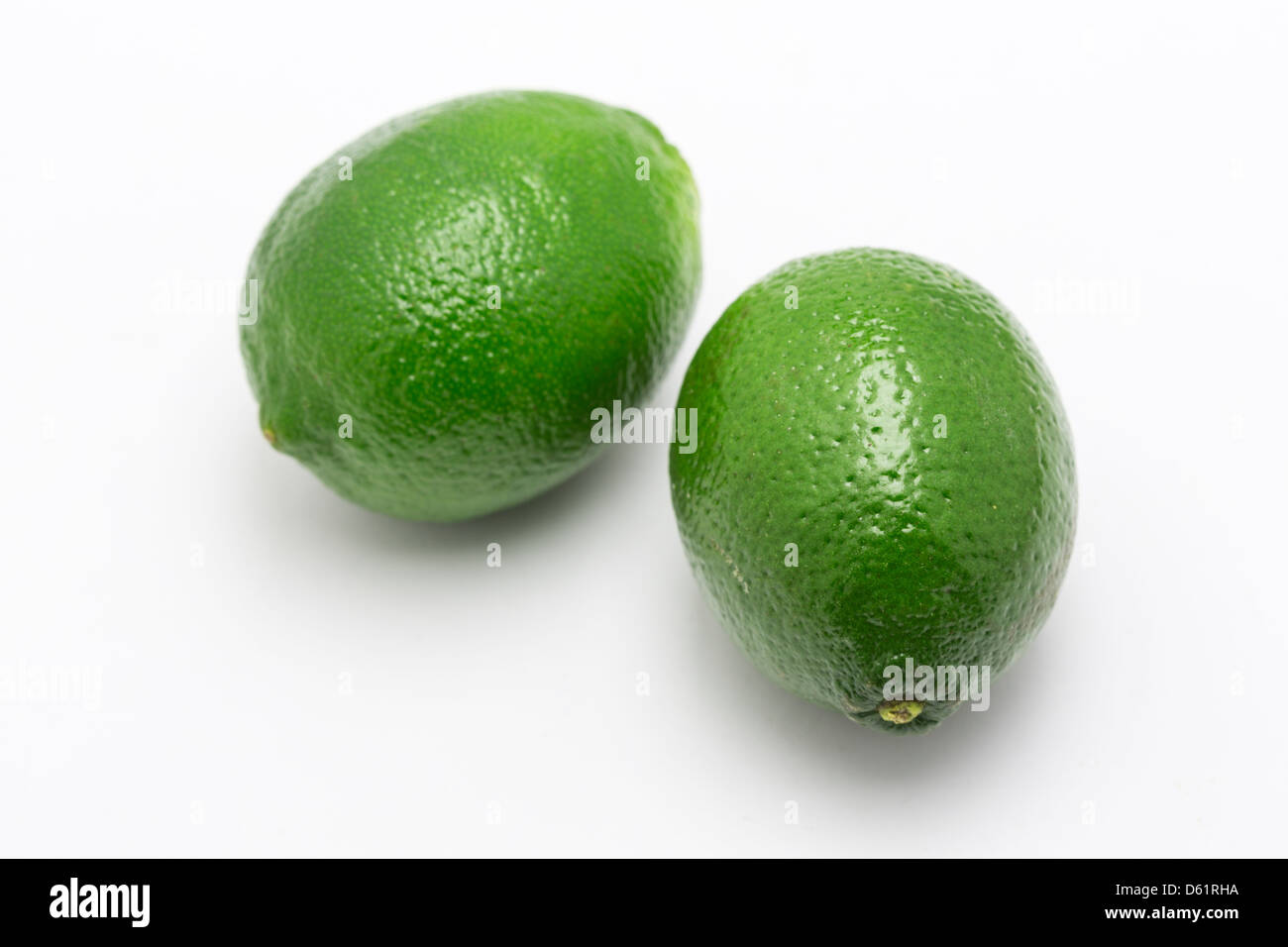 Two Limes on white background Stock Photo - Alamy