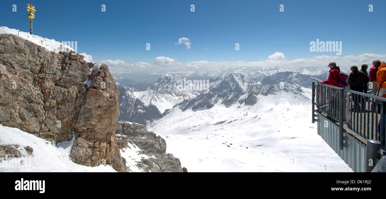 Visitors enjoy the view from the viewing platform on the peak of the ...