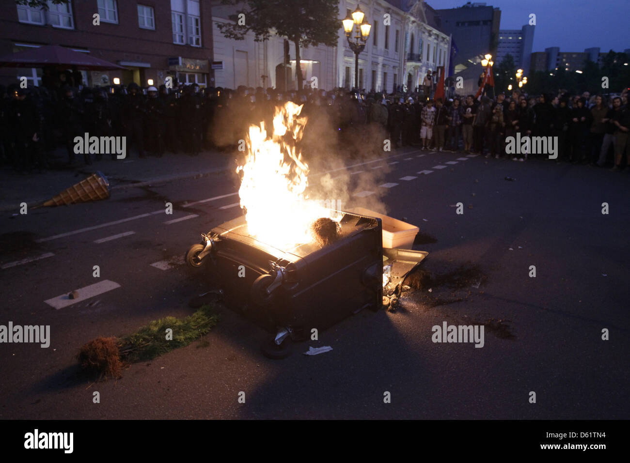 Protesters have set a garbage can on fire in front of the Jewish Museum ...