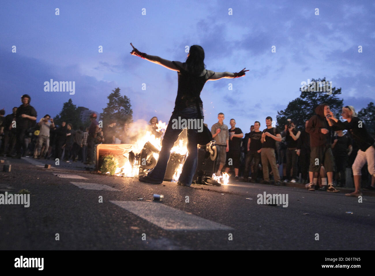 Protesters have set a garbage can on fire in front of the Jewish Museum ...