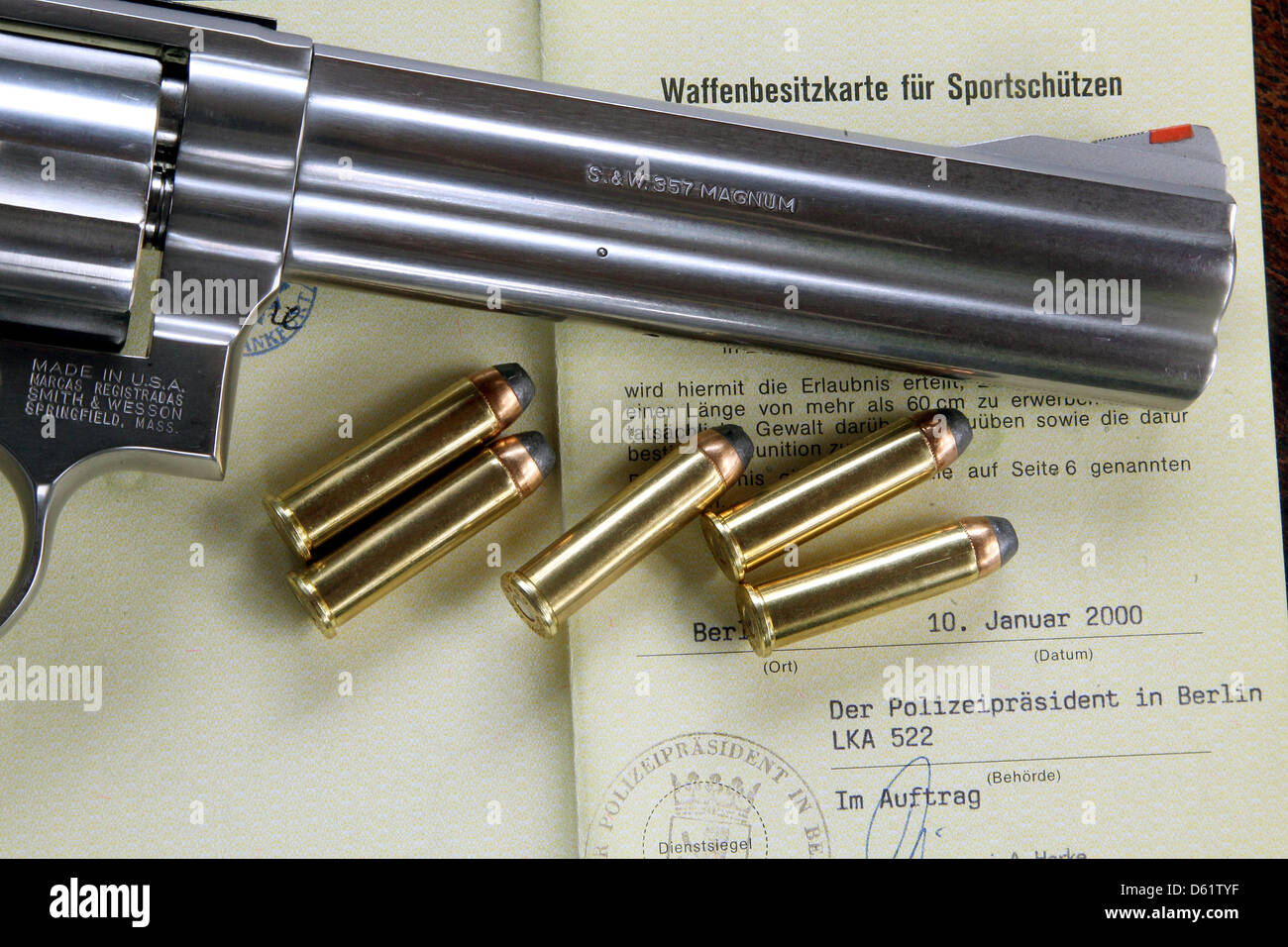 A female marksman loads her gun at a shooting range in Berlin, Germany ...