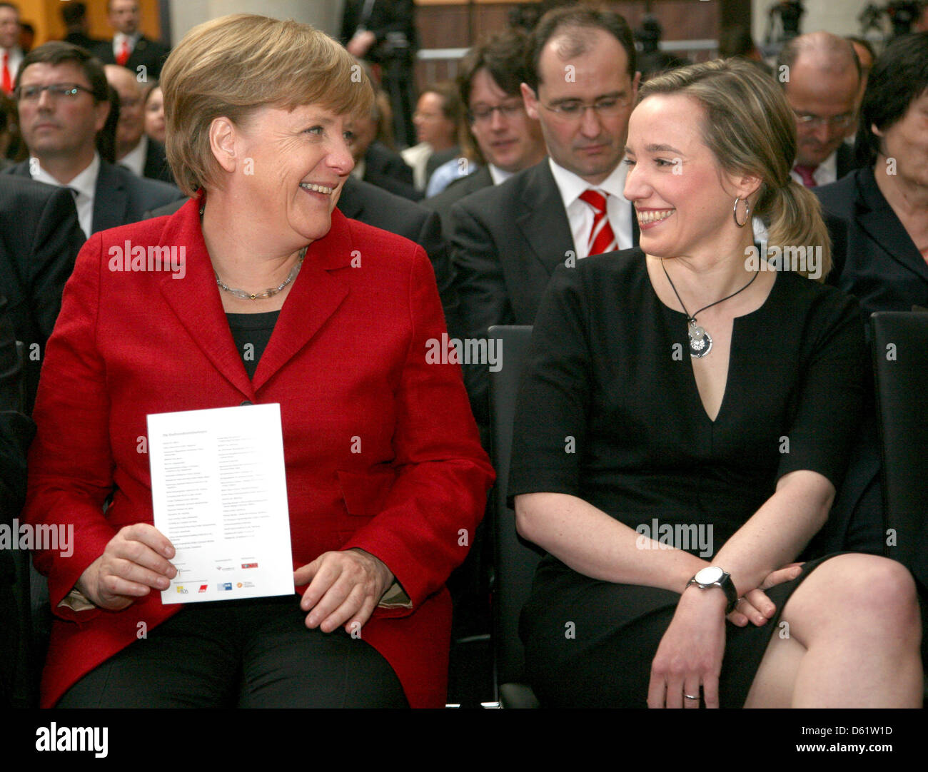 German Chancellor Angela Merkel (L) and Family Minister Kristina ...
