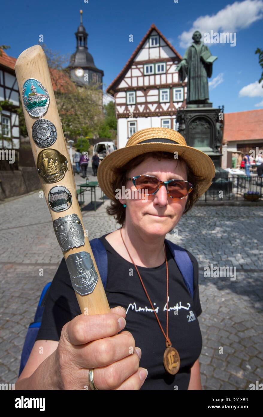 Hiker Christina Reissig shows her hiking stick with the locations on ...