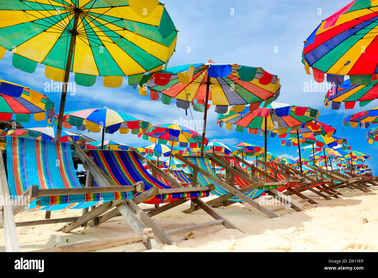 Beach chair and umbrellas on the beach - Kay Island, Thailand Stock ...