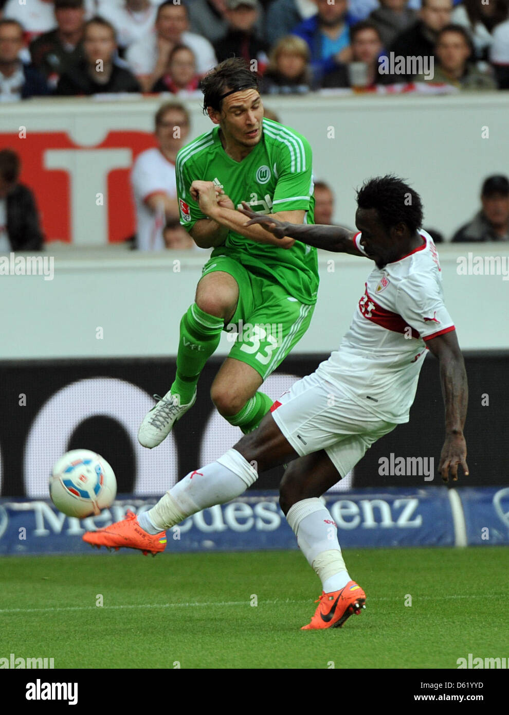 Stuttgart's Arthur Boka (R) and Wolfsburg's Patrick Helmes vie for the ...
