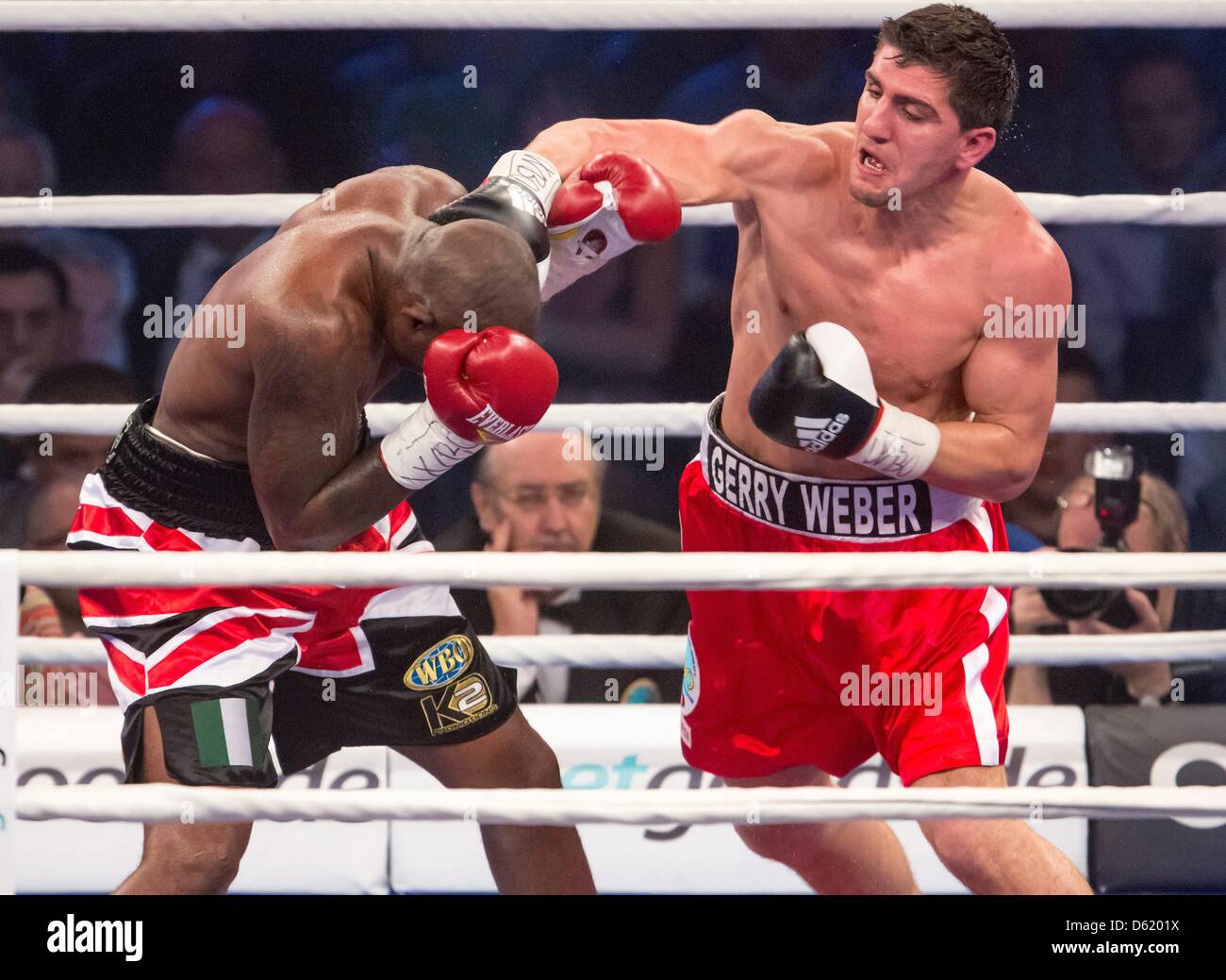 German professional boxer Marco Huck (R) and Ola Afolabi from Great ...