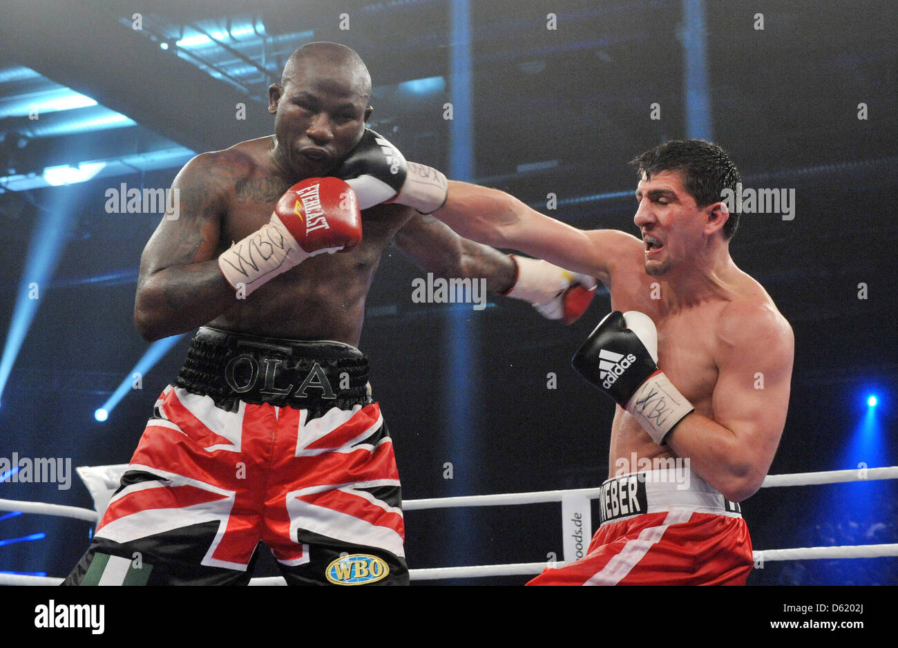 German professional boxer Marco Huck (R) and Ola Afolabi from Great ...
