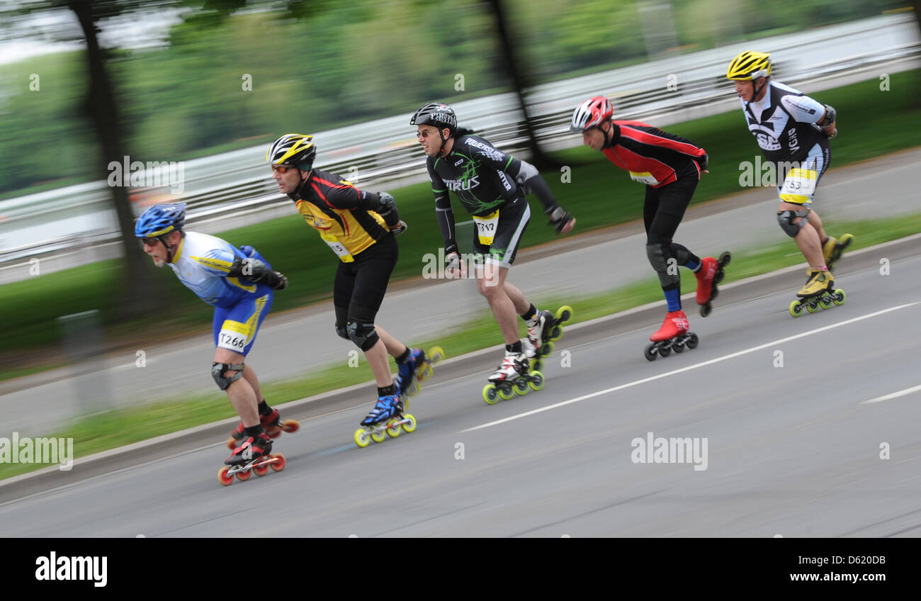 Inline skaters mirror in a paddle during the Hanover Marathon in ...