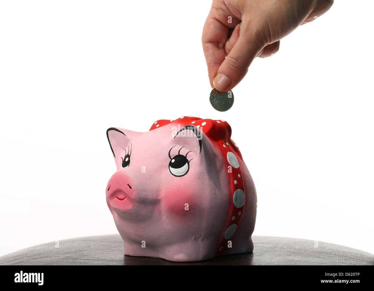 retirement Coin box pink pig and hand Stock Photo - Alamy
