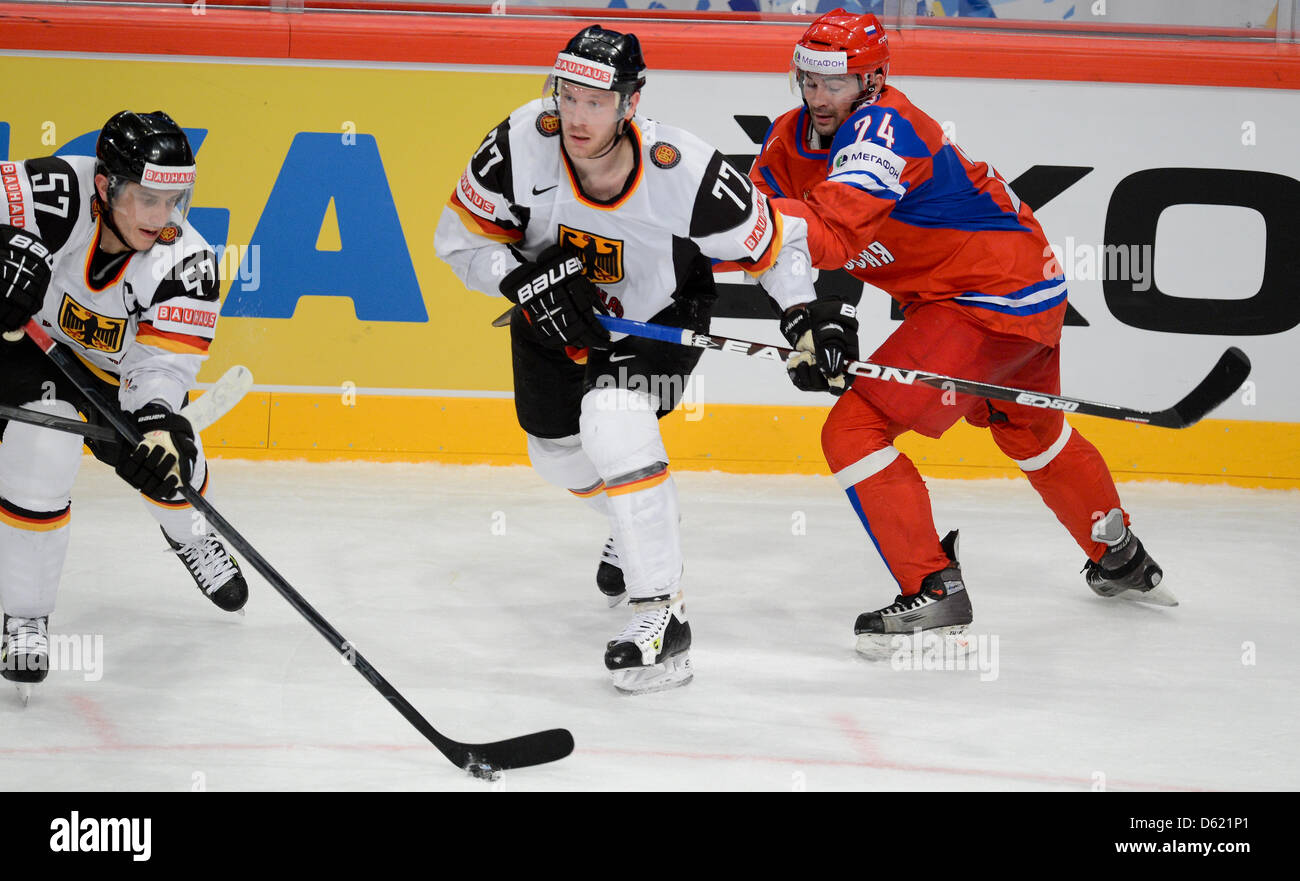 Germany's Marcel Goc (l), Nikolai Goc and Russia's Alexander Popov vie ...