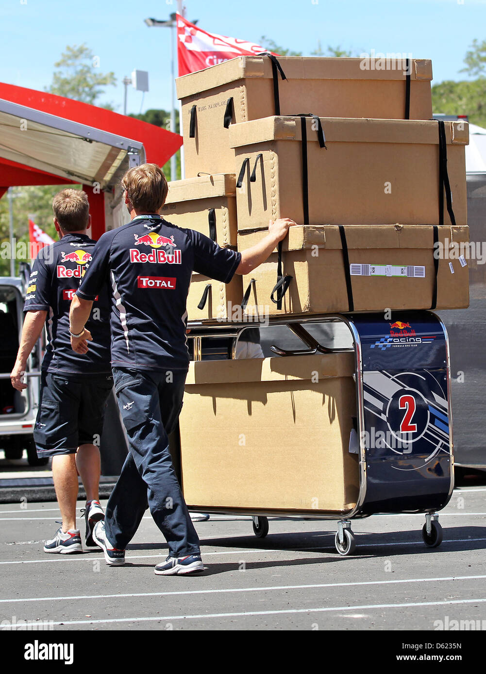 Mechanics of Red Bull carry boxes at the Circuit de Catalunya in ...
