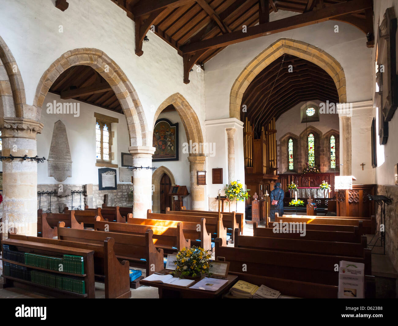 Woman admiring the Interior of the 11th Century Saxon church of St ...