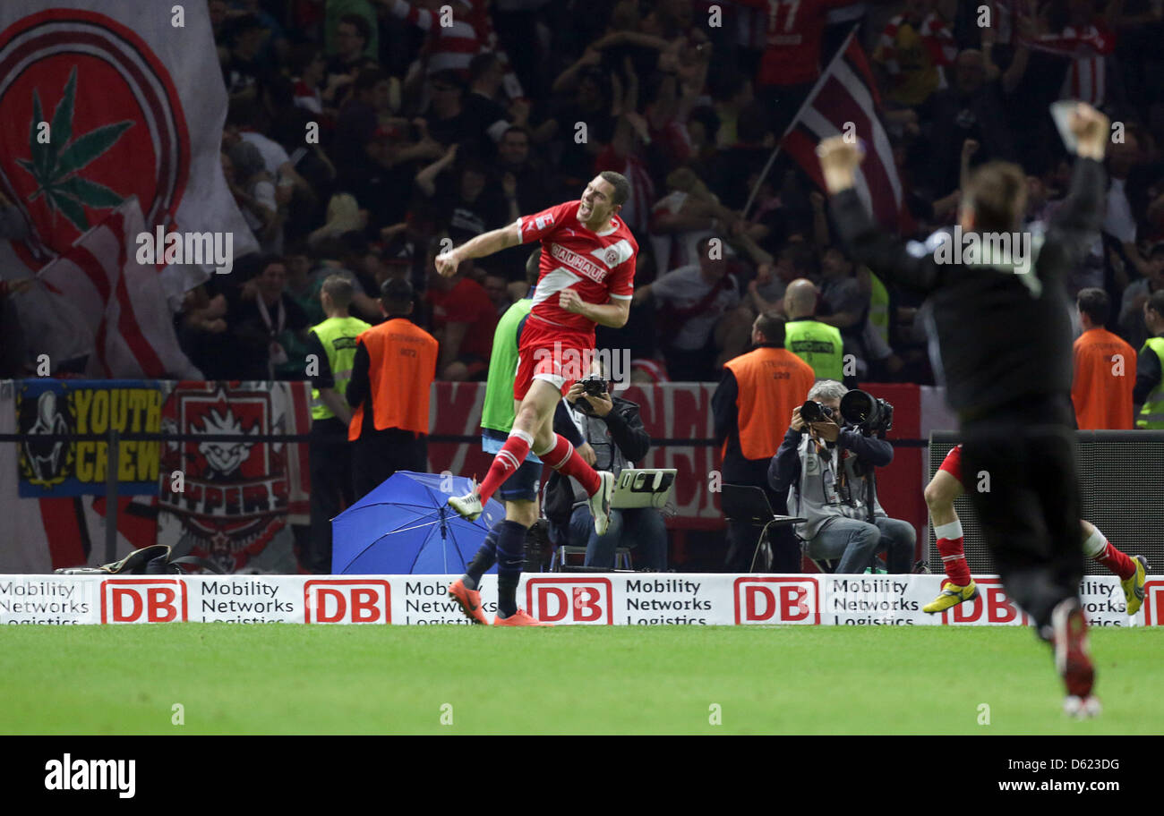 Duesseldorf's Thomas Broeker (C) celebrates his 1-1 goal during the ...