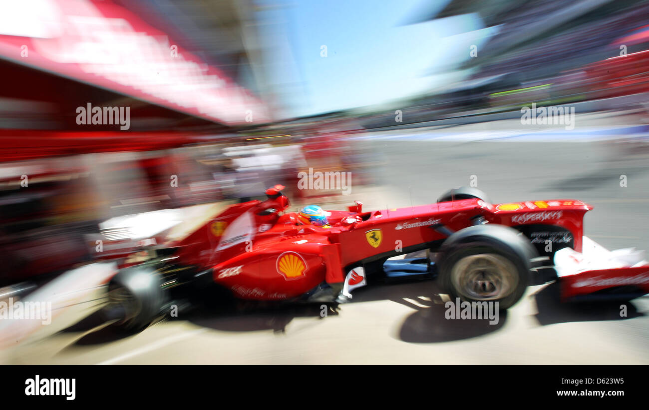 Spanish Formula One driver Fernando Alonso of Ferrari steers his car in ...