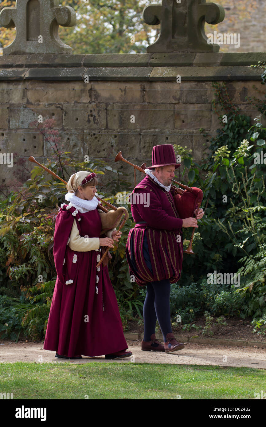Authentically Dressed Actors In Elizabethan Period Costumes During Reenactment Of Tudor Times