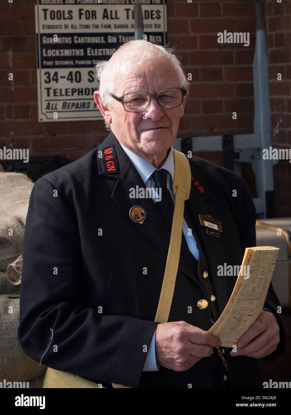 Elderly man dressed as a ticket collector on Sheringham Station during ...