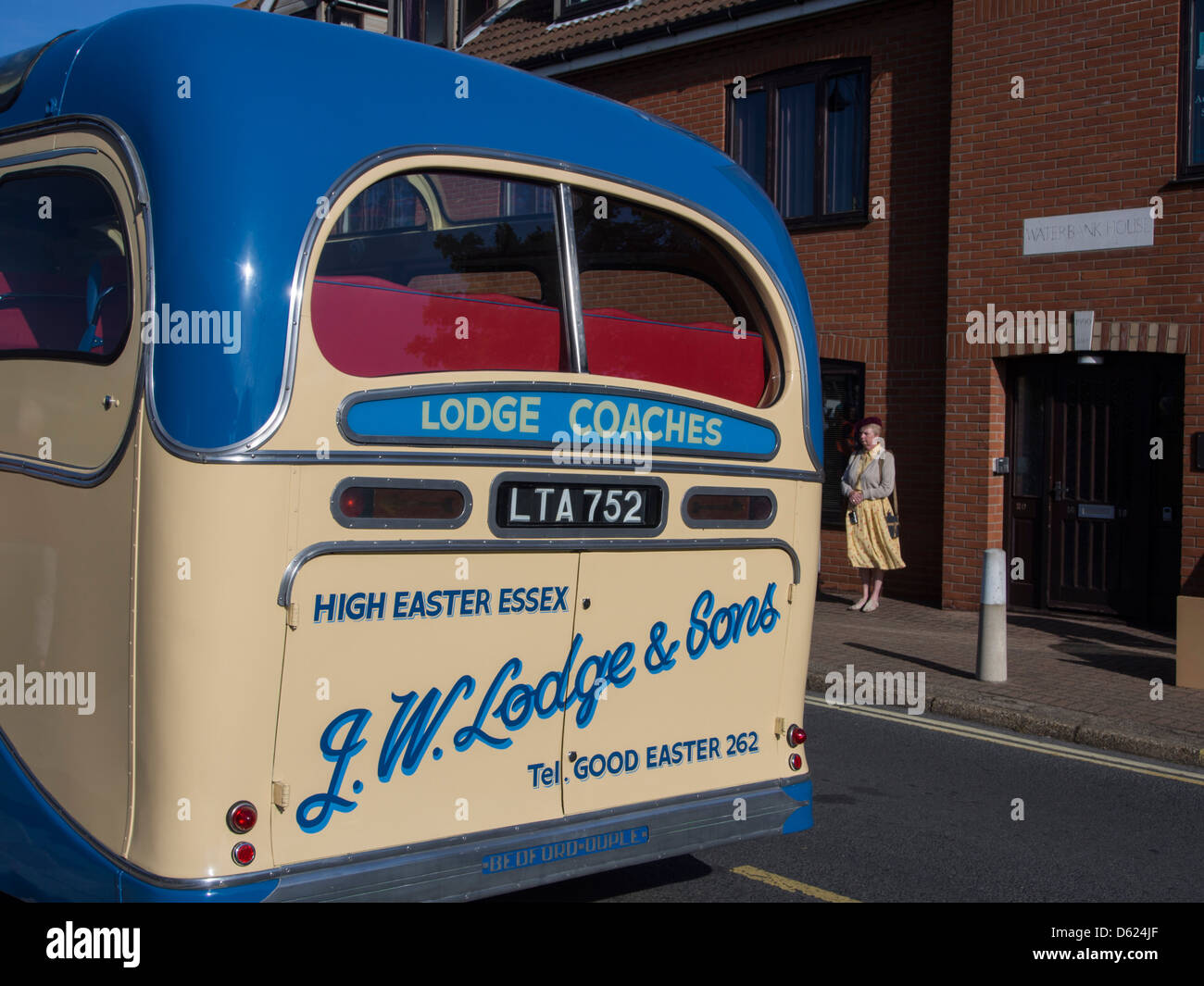 Old fashioned early motor coach parked on roadside at Sheringham ...