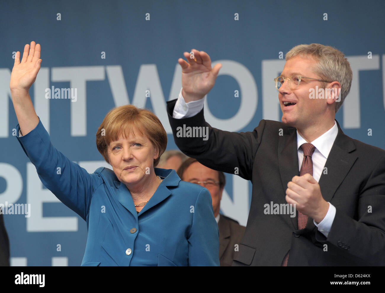 German Chancellor Angela Merkel (L) and top candidate for the NRW state ...