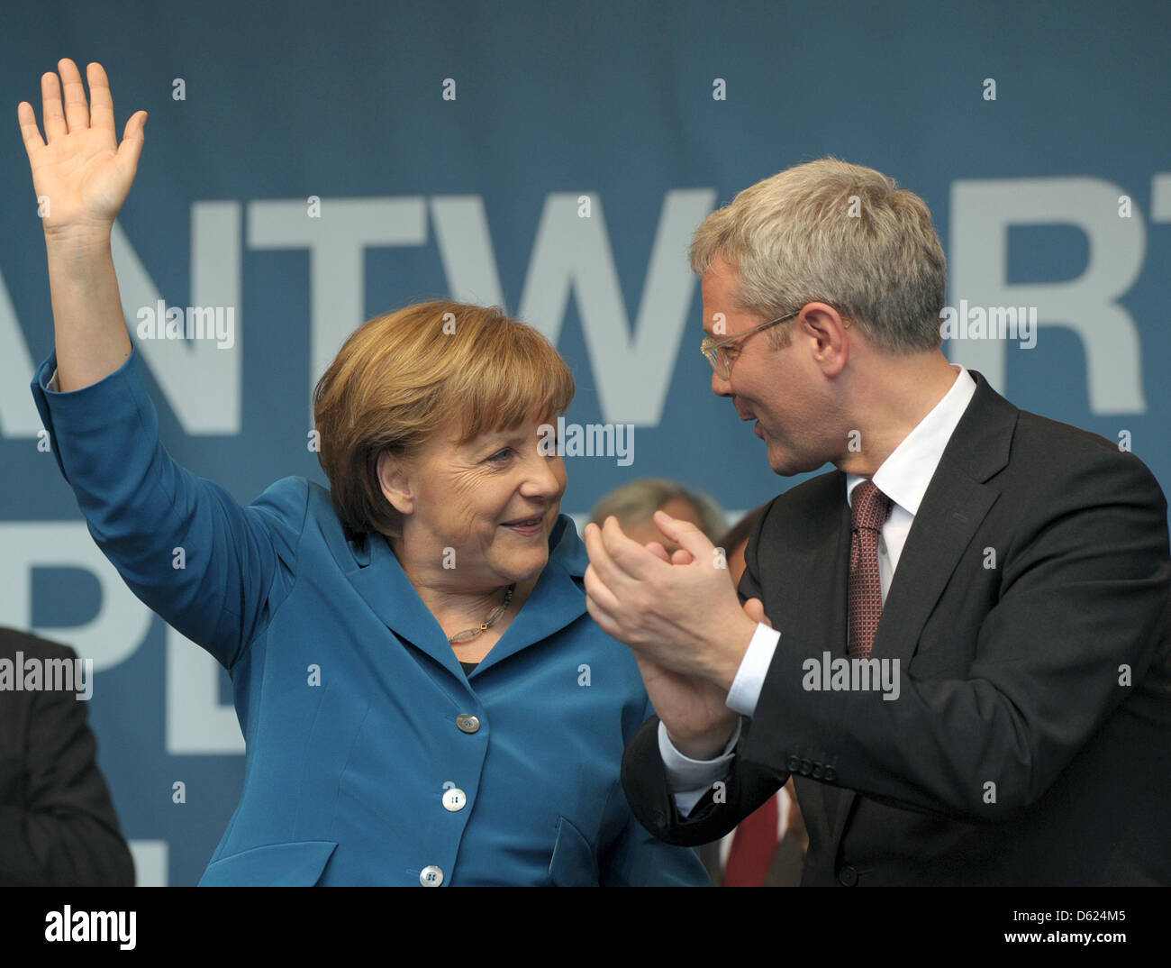 German Chancellor Angela Merkel (L) and top candidate for the NRW state ...