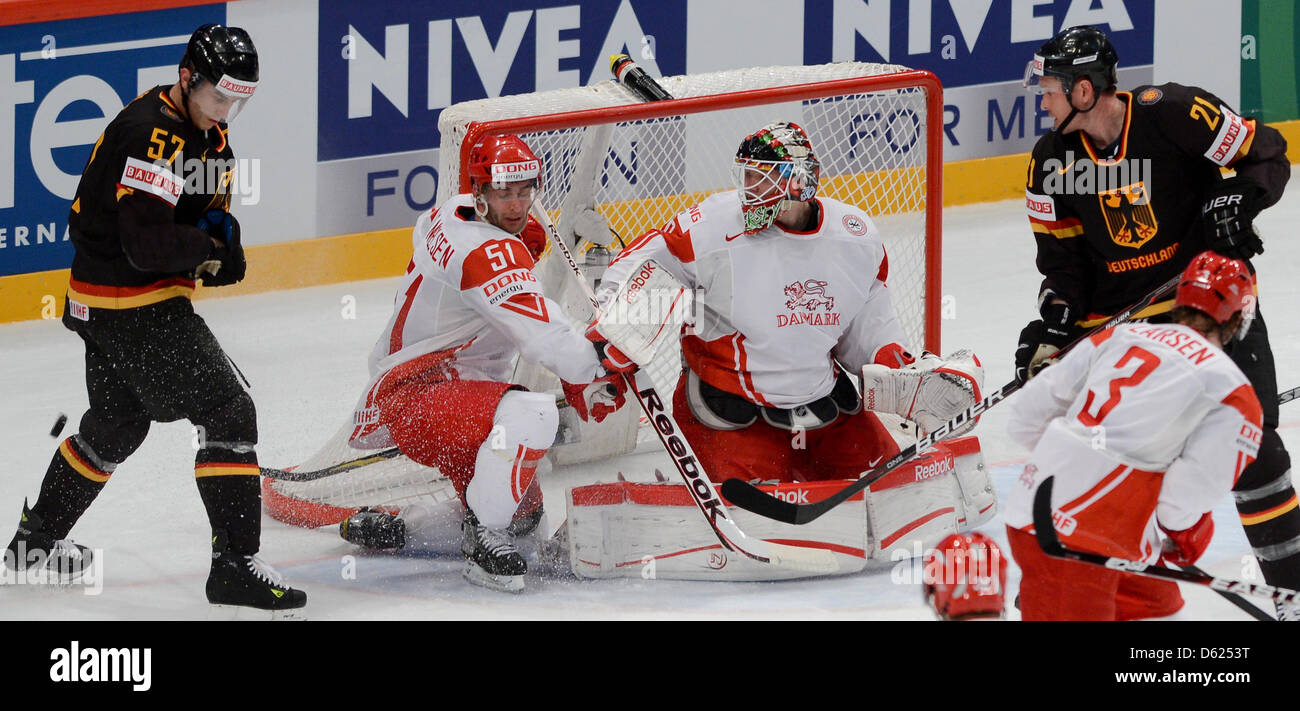 Germany's Marcel Goc (l), John Tripp (r) and Denmark's Frans Nielsen (2 ...