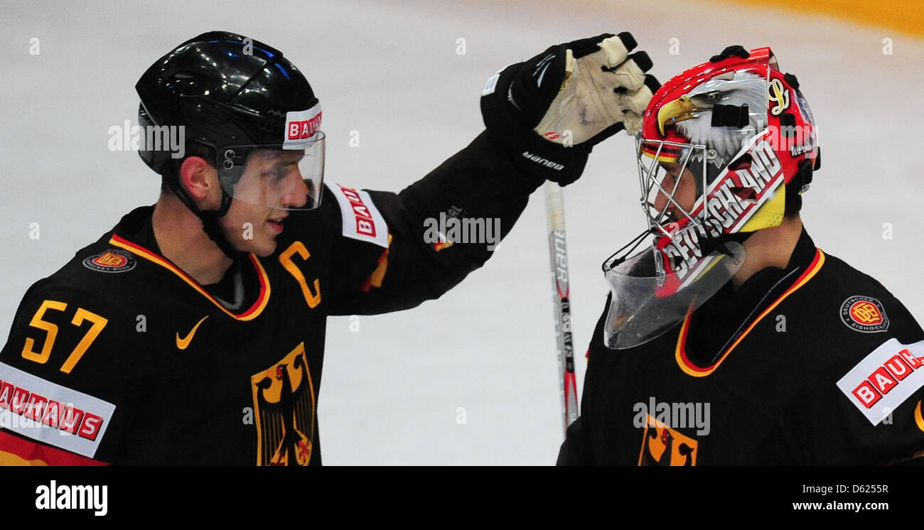 Germany's Marcel Goc (L) and Germany's goalkeeper Dennis Endras ...