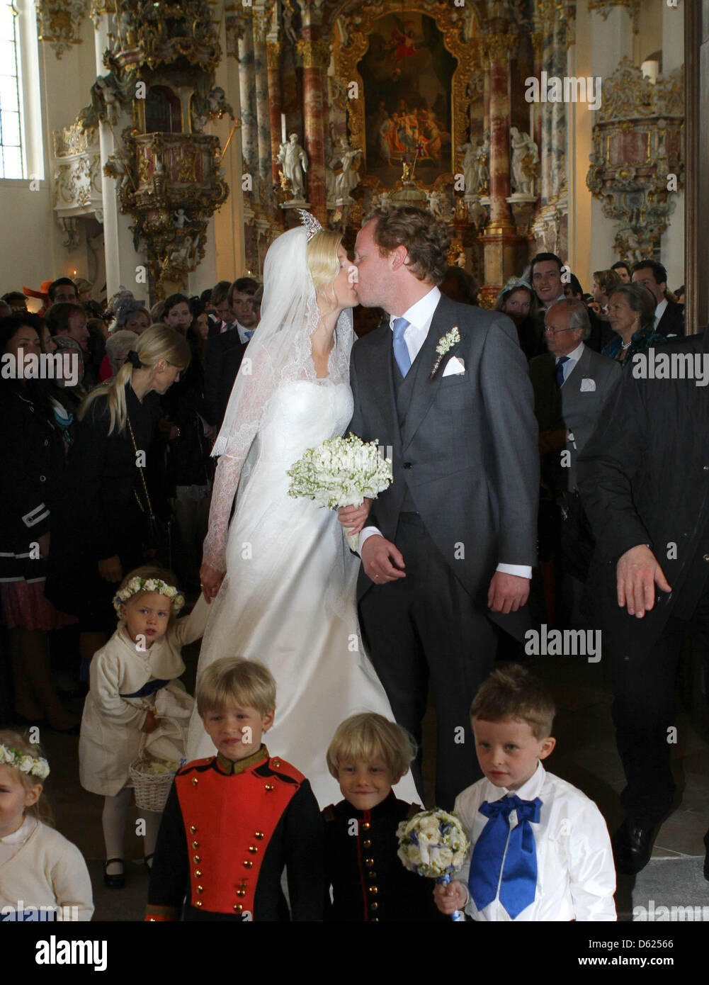 Wedding couple kisses after marriage hi-res stock photography and ...
