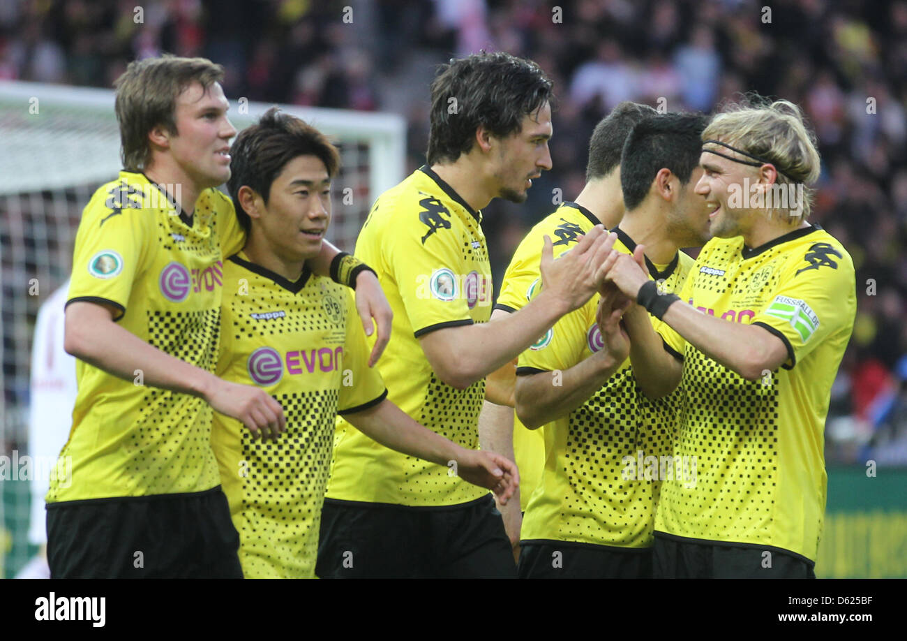 Dortmund's Mats Hummels (C) celebrates after scoring the 2-1 with his ...