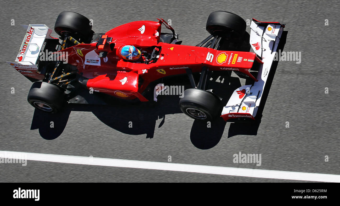 Spanish Formula One driver Fernando Alonso of Ferrari steers his car ...