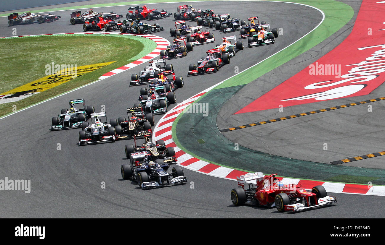 Spanish Formula One driver Fernando Alonso of Ferrari leads the pack ...