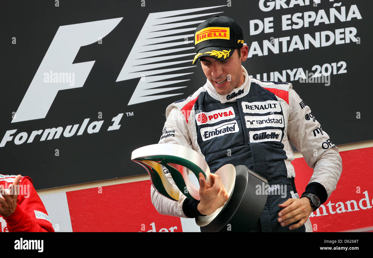 Venezuelan Formula One driver Pastor Maldonado of Williams cheers after ...