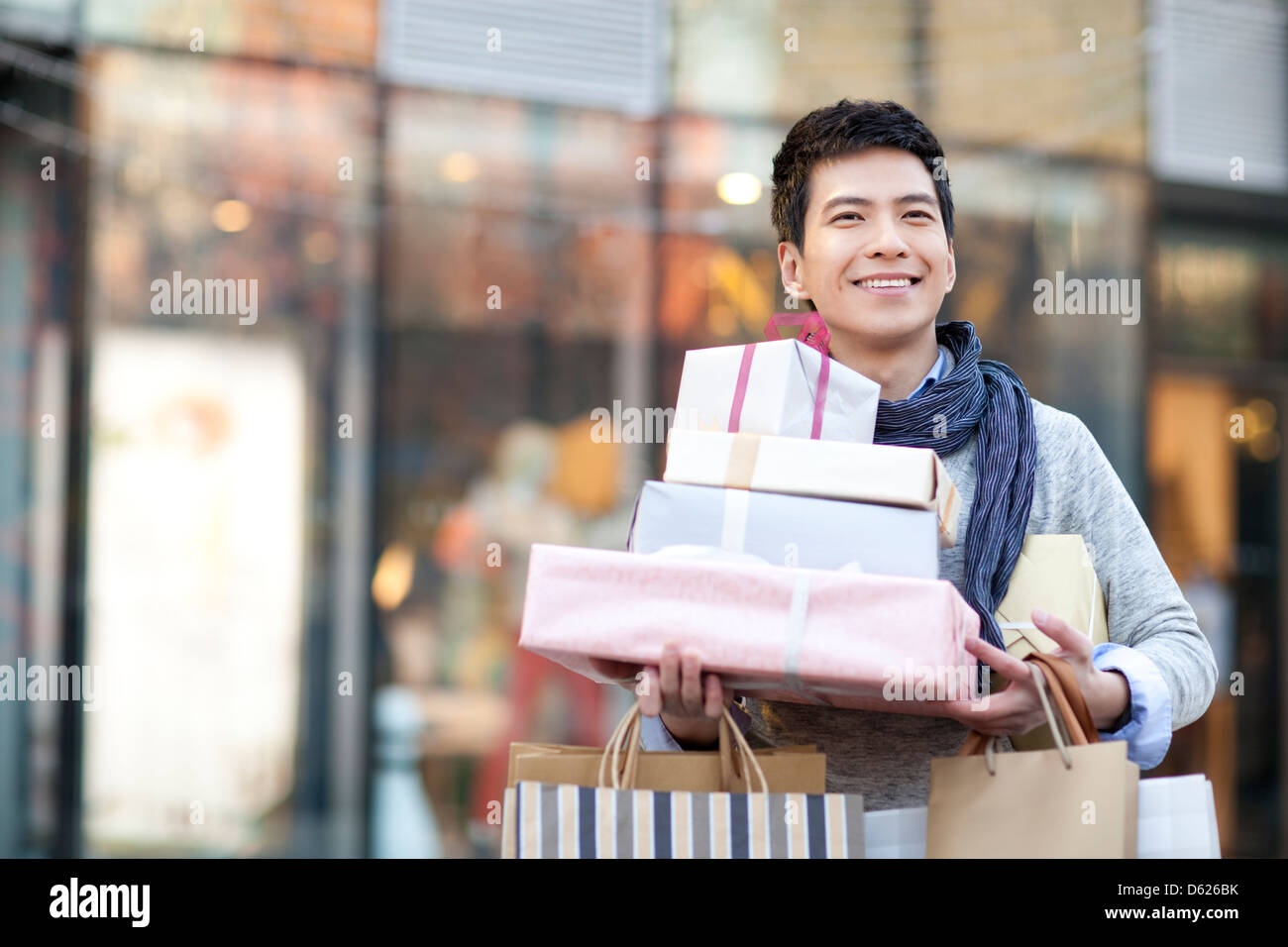 Fashionable young man shopping Stock Photo - Alamy