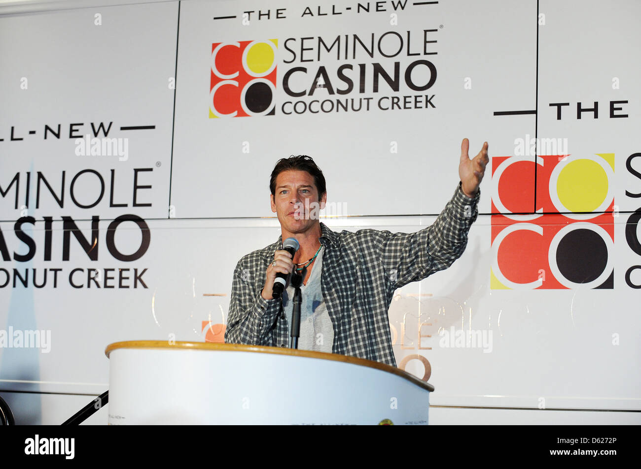 Ty Pennington 'Moves That Bus' to celebrate the grand opening of the ...