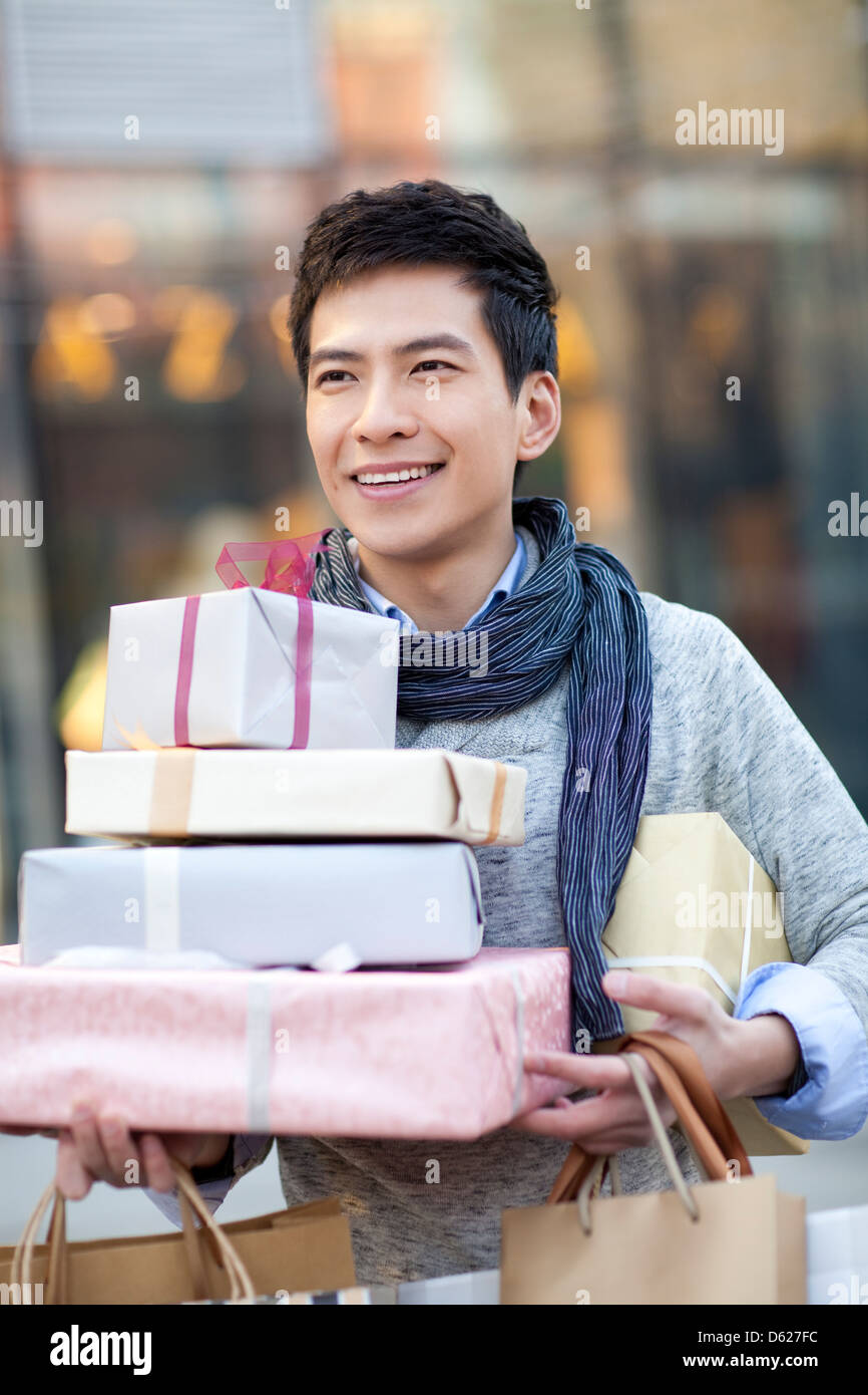 Fashionable young man shopping Stock Photo - Alamy
