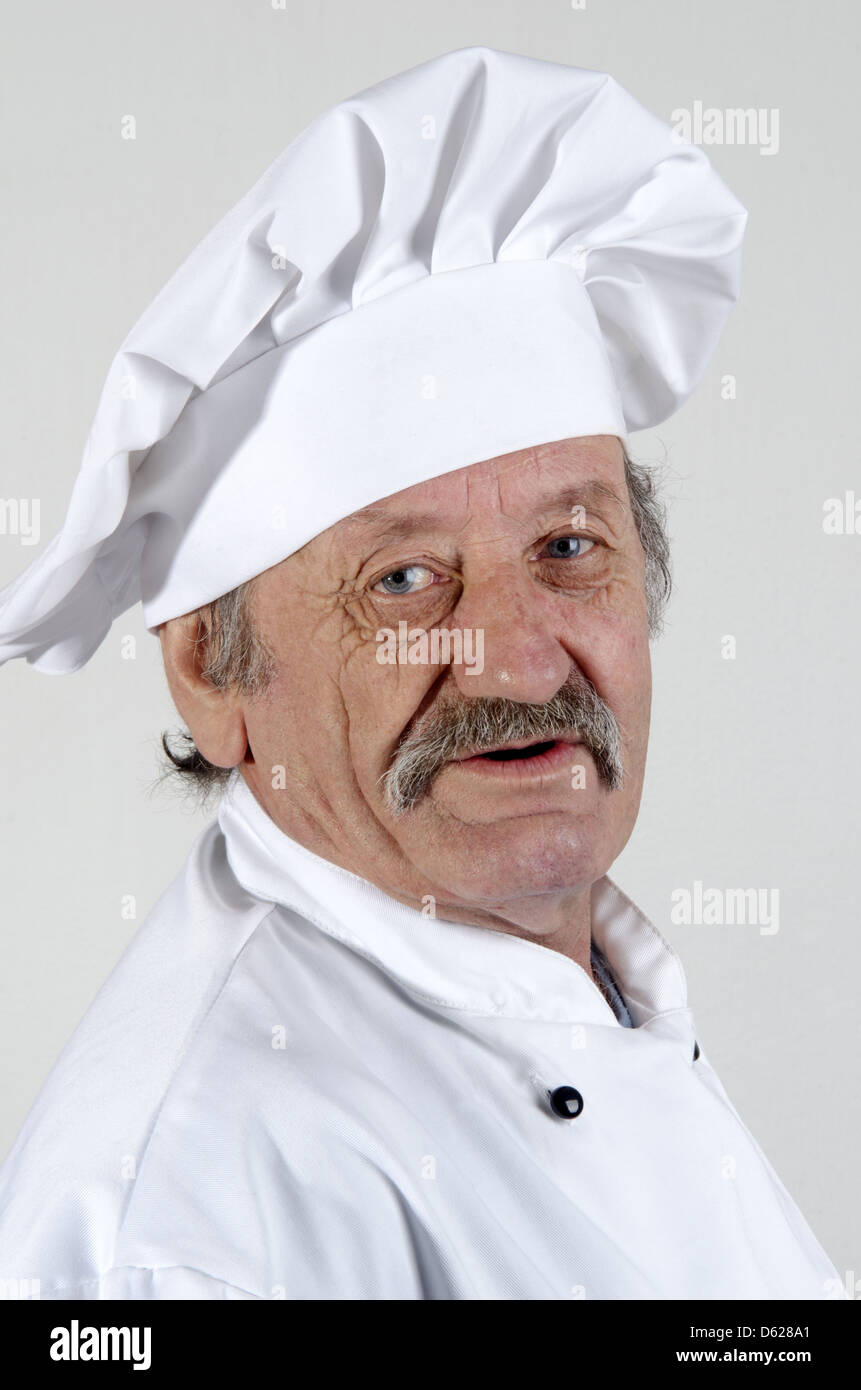 professional male chef in white working uniform Stock Photo - Alamy