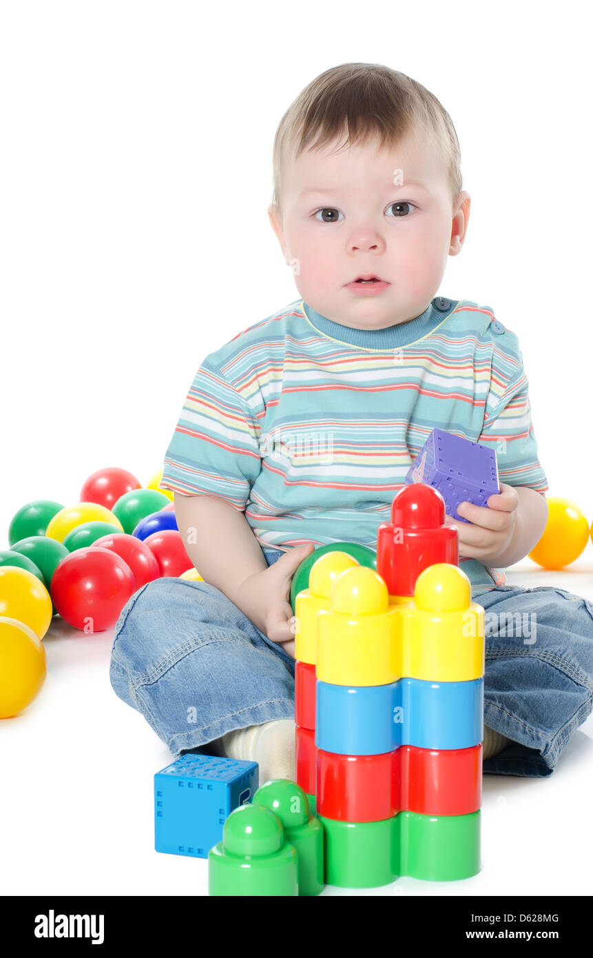 The little boy plays multi-coloured toys Stock Photo - Alamy