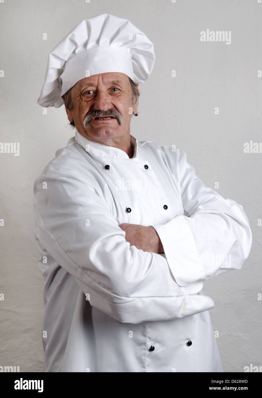professional senior chef in white working uniform Stock Photo - Alamy