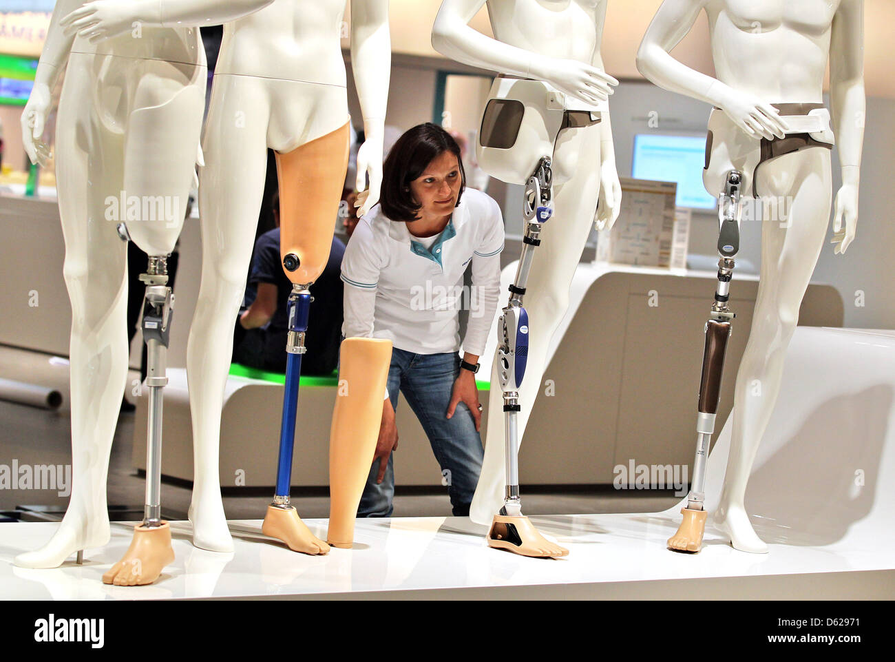 A woman looks at knee and hip prosthetics from Otto Bock at the ...