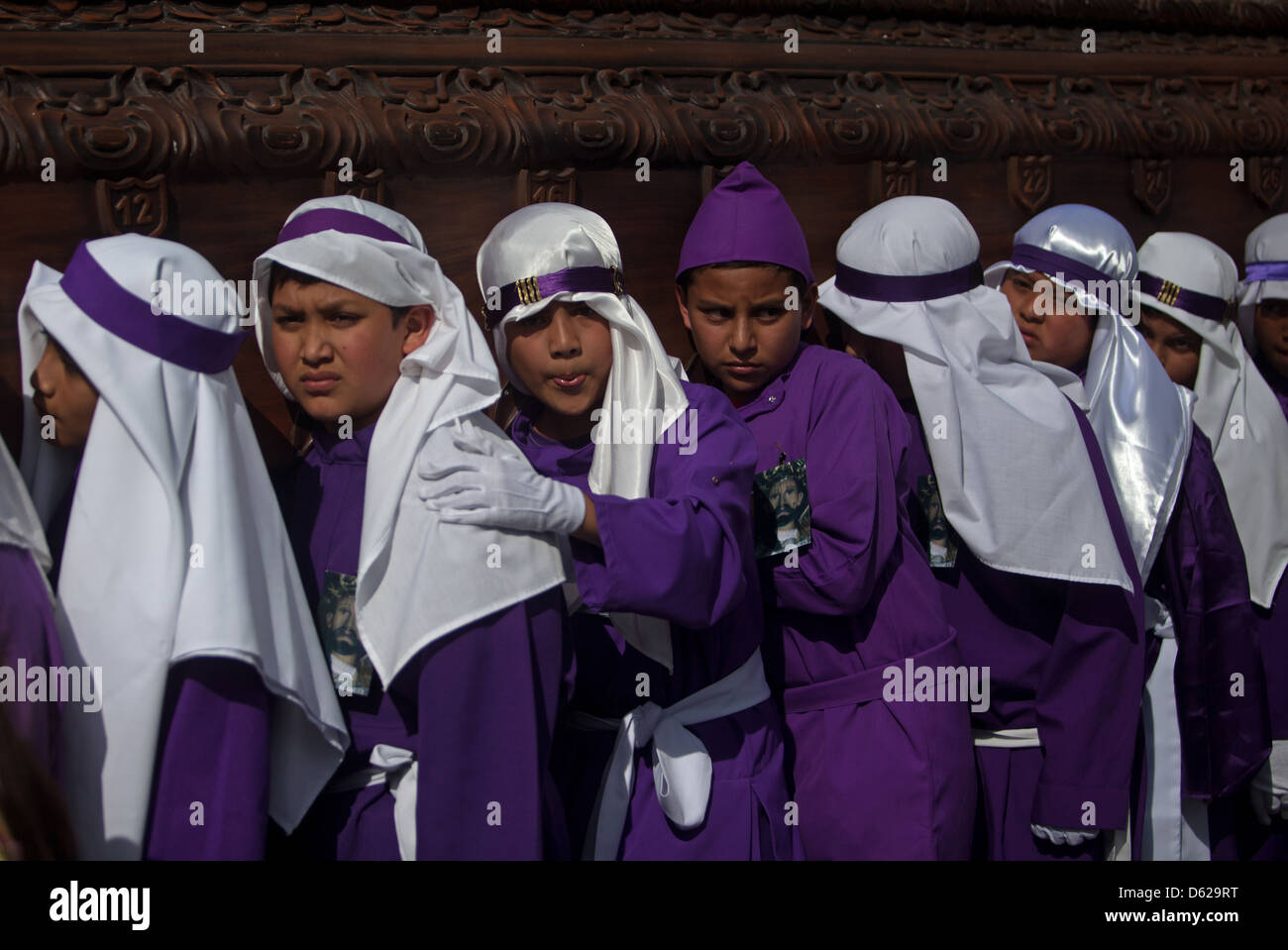 Boys carry a throne on their shoulders during La Merced's children ...