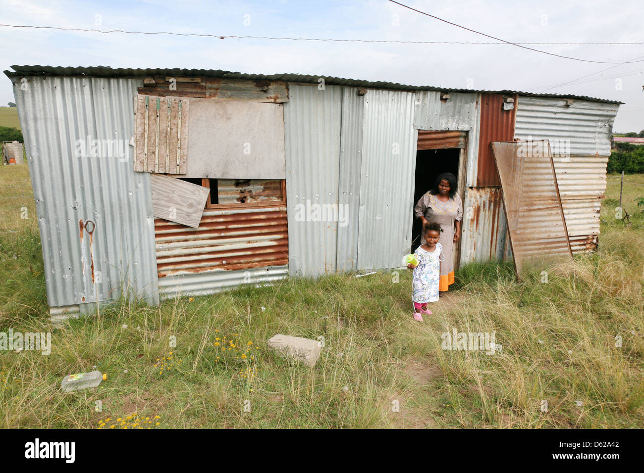 African woman in front of a shack in Hamburg, South Africa Stock Photo ...