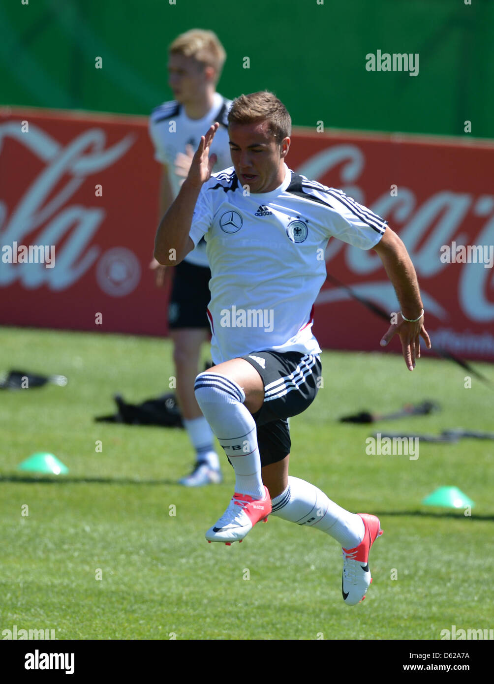 German national soccer players Mario Goetze (FRONT) and Marco Reus take ...