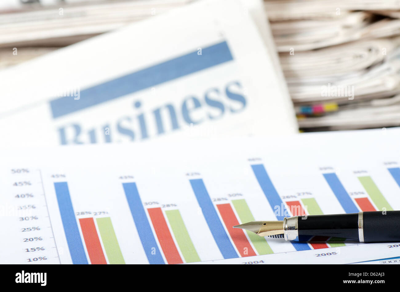 Business the newspaper with chart Stock Photo - Alamy
