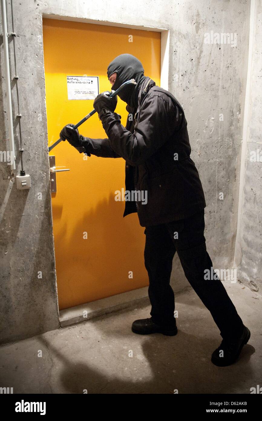 ILLUSTRATION - An illustrated picture shows a man prying open a door ...