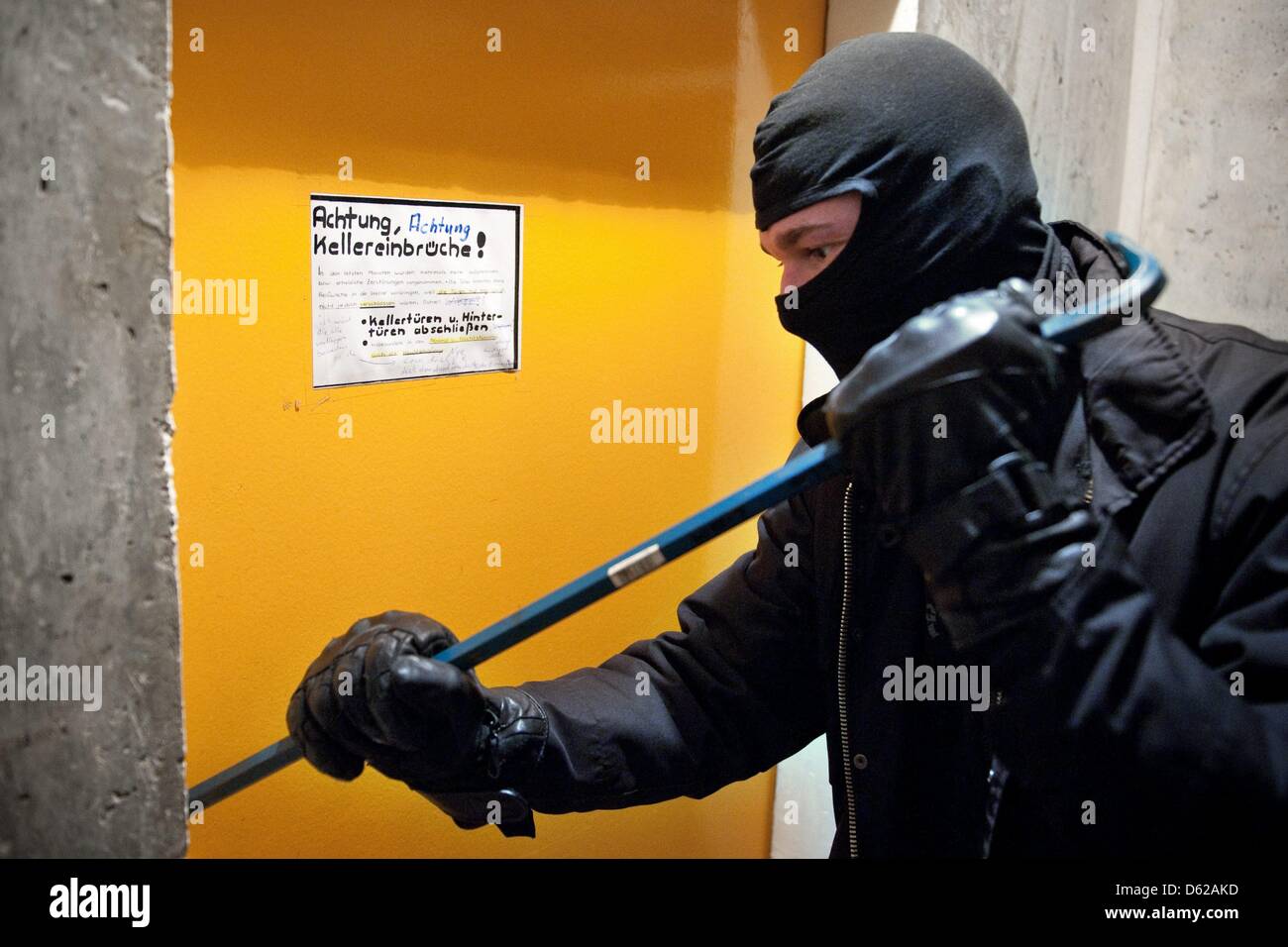 ILLUSTRATION - An illustrated picture shows a man prying open a door ...