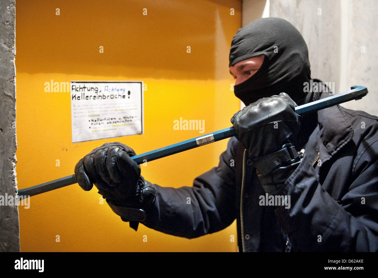 ILLUSTRATION - An illustrated picture shows a man prying open a door ...