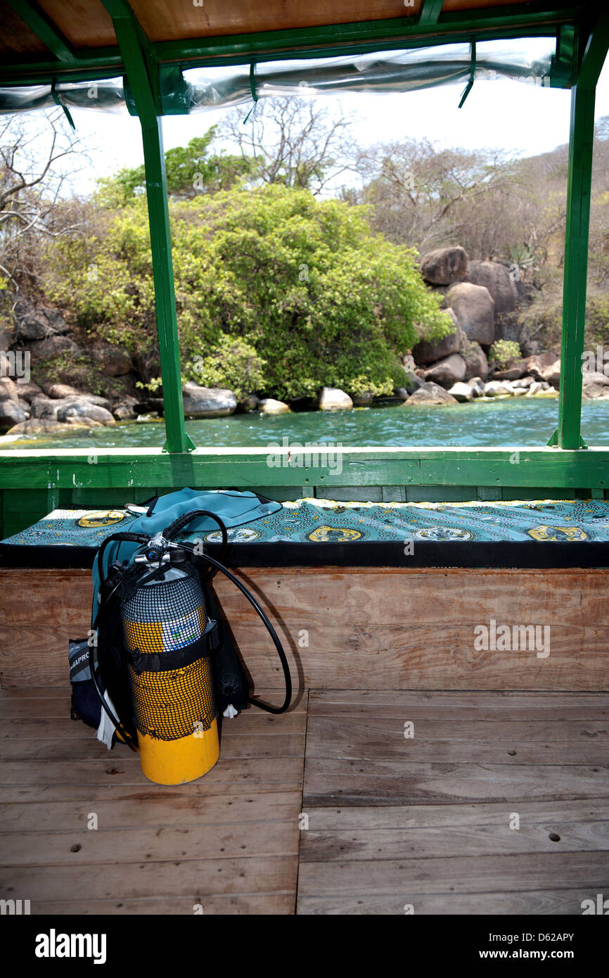 Yellow diving tank on wooden deck Stock Photo - Alamy