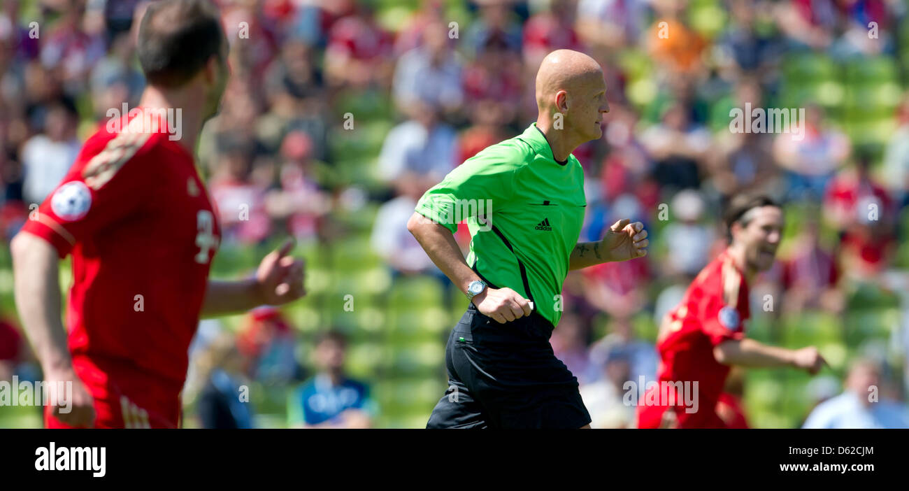 Referee Pierluigi Collina runs across the pitch during the Ultimate ...
