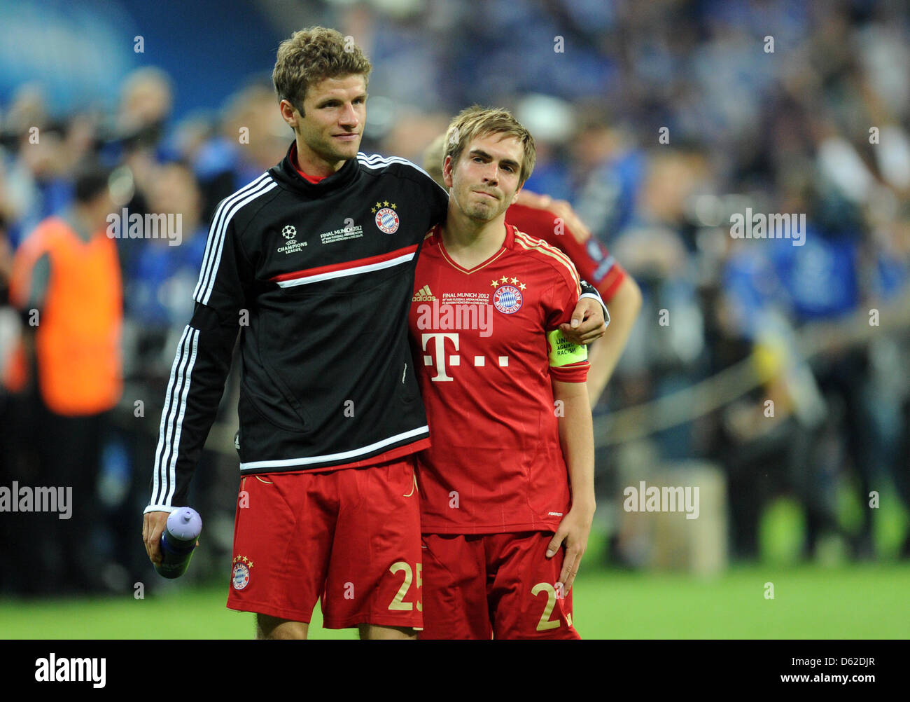 Munich's Thomas Mueller and Philipp Lahm (R) react after the UEFA ...