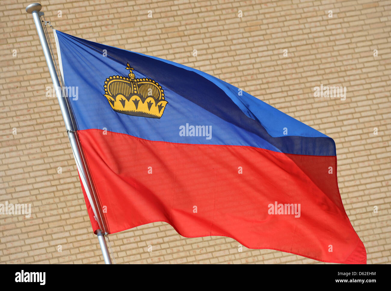 The Liechtenstein flag in front of the state parliament in Vaduz ...